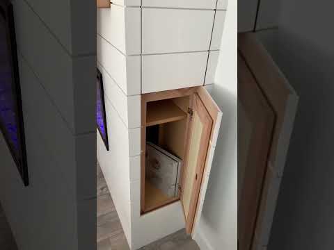 A little more detail on the hidden storage. #fireplace #diyfireplace #electricfireplace #organize