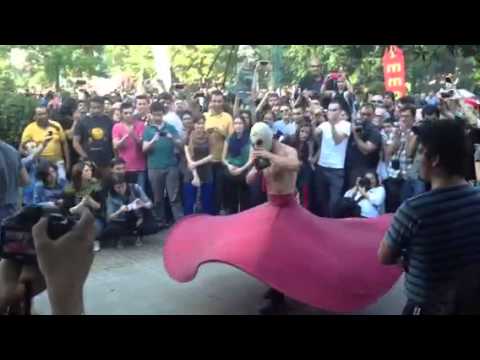 Protestor does a Sufi whirling dervish dance in a gas mask in Gezi.