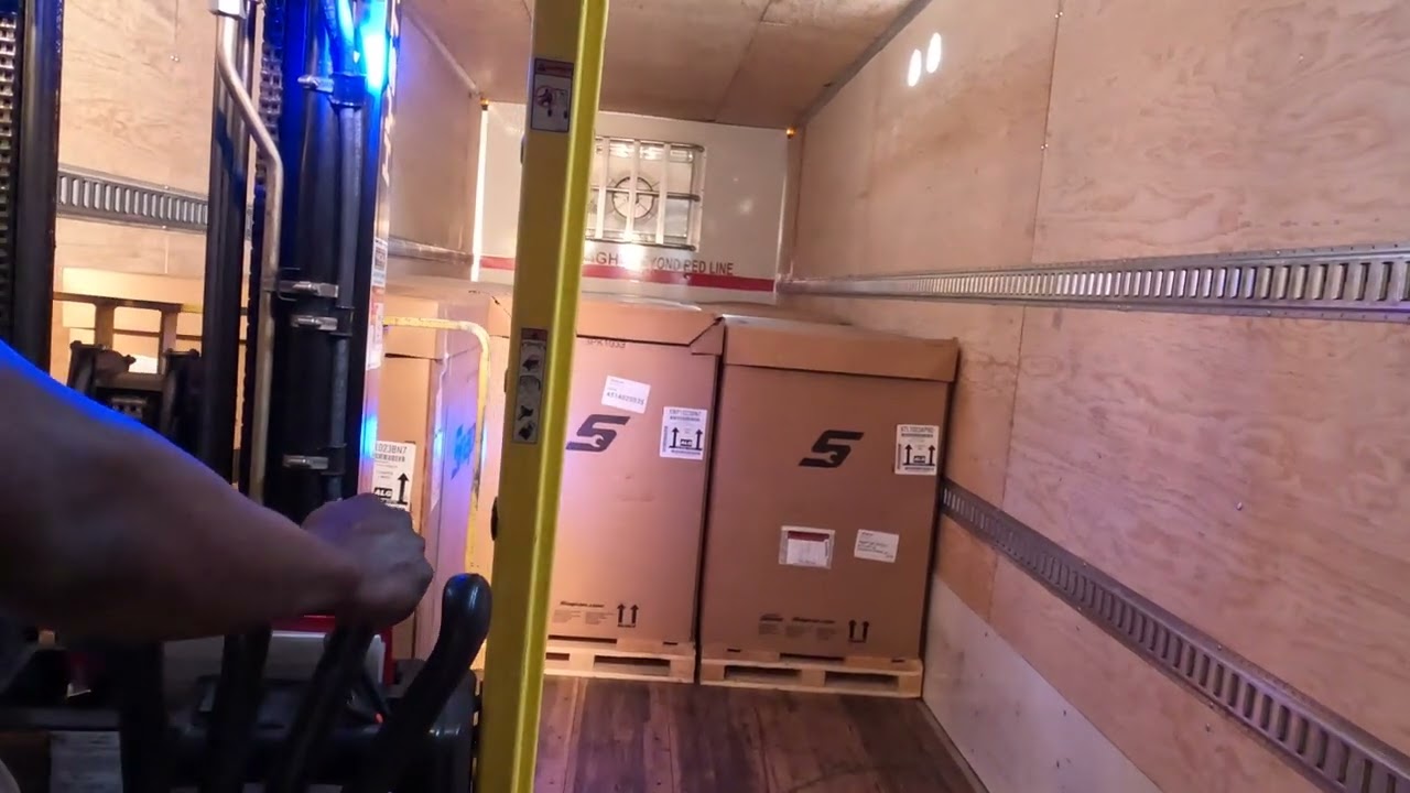 Forklift Jo Unloading Trailer