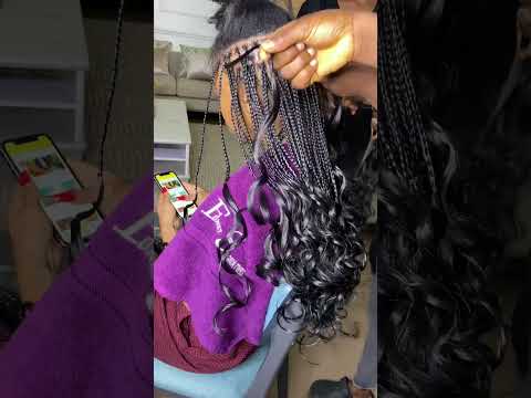 Braiding the French curls neatly. Curly braiding hair.