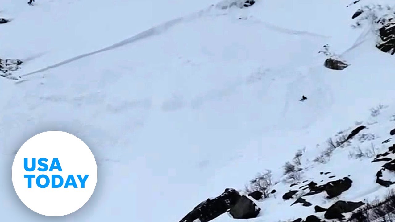 Caught on camera: Snowboarder getting swallowed, carried by avalanche | USA TODAY