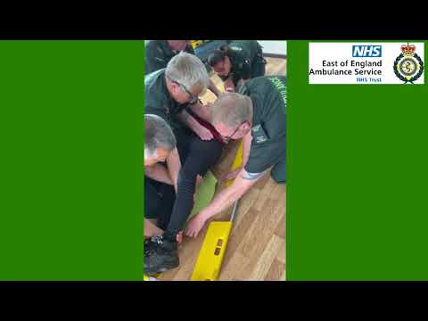 Putting a patient in a scoop stretcher using the pelvic binder and head blocks.