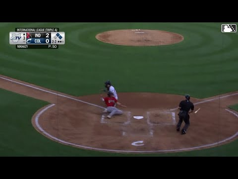 Chase DeLauter throws out a runner at home