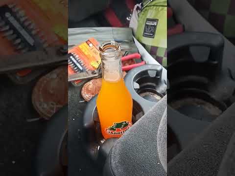 opening a Jarritos with the Mountain  Guide knife