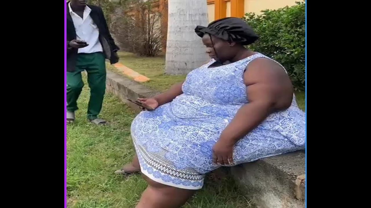 Huge African ssbbw model sit in the garden 