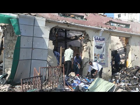 People clear rubble day after twin blasts rock Somali capital | AFP