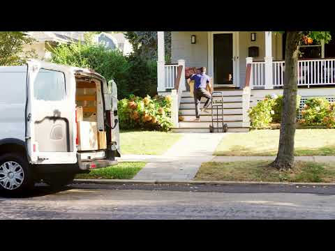 courier using trolley to deliver package to house SBV 323524798 4K