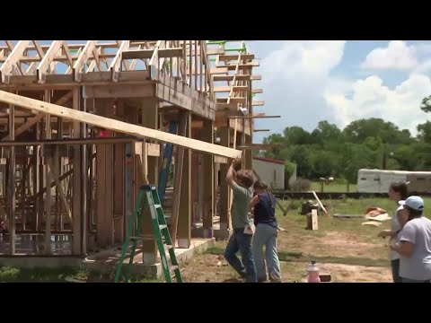 Student Volunteers Build Homes For Families In Need in Houston area