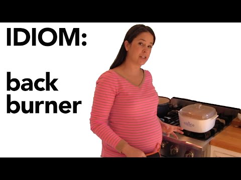 Idiom "Back Burner" -- How to Use and Pronounce -- American English
