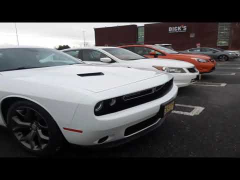 Two Different types of cars in parking spot!!!!