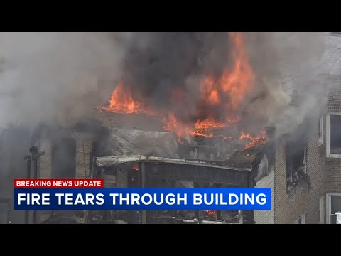 LATEST UPDATES: Large Chicago porch fire spreads to roof, 2nd building on Northwest Side, CFD says