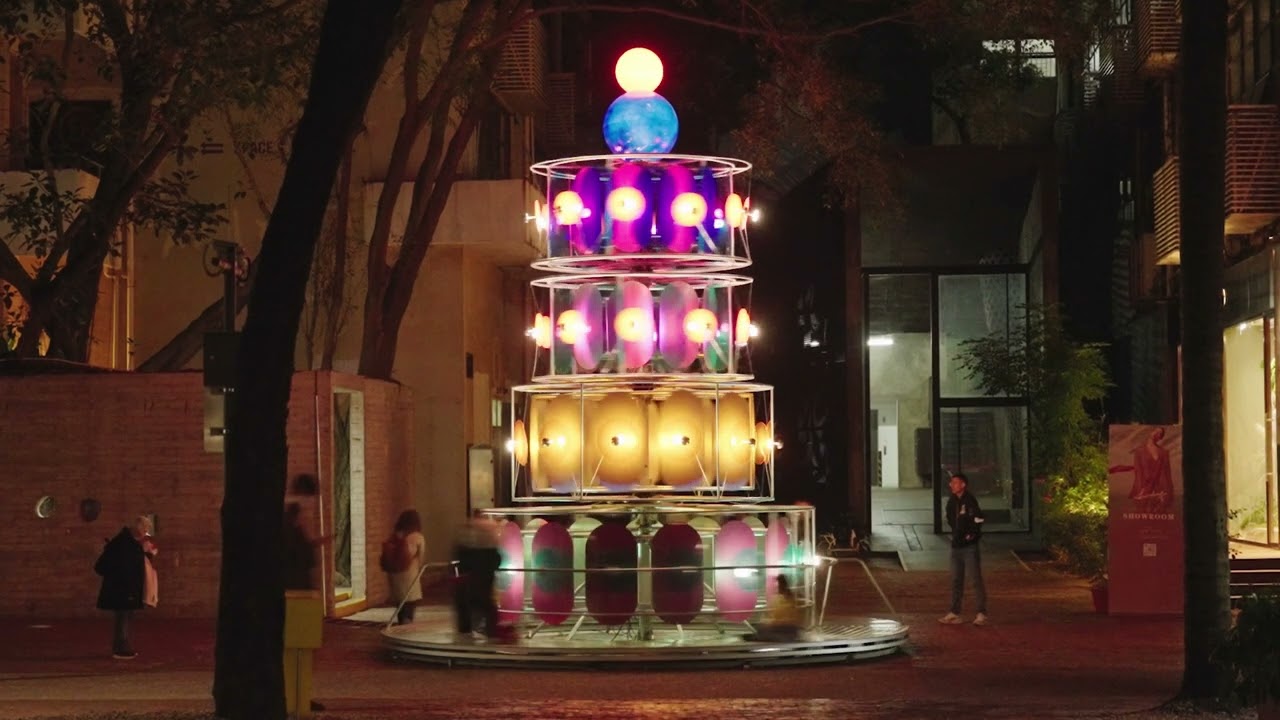 cake-like layers stack into a shared motion installation in china, bringing strangers into sync
