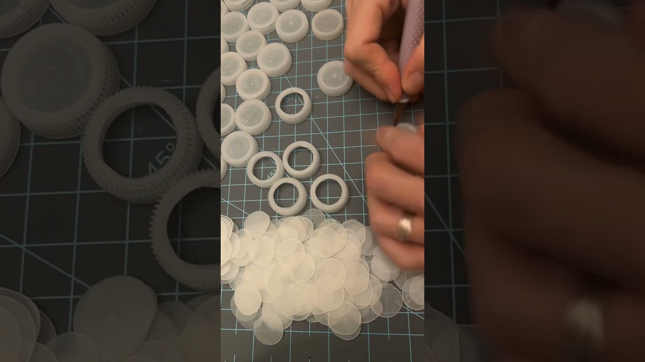 Turning bottle caps collected during clean-ups into jewelry #recycling #recycledjewelry #upcycling