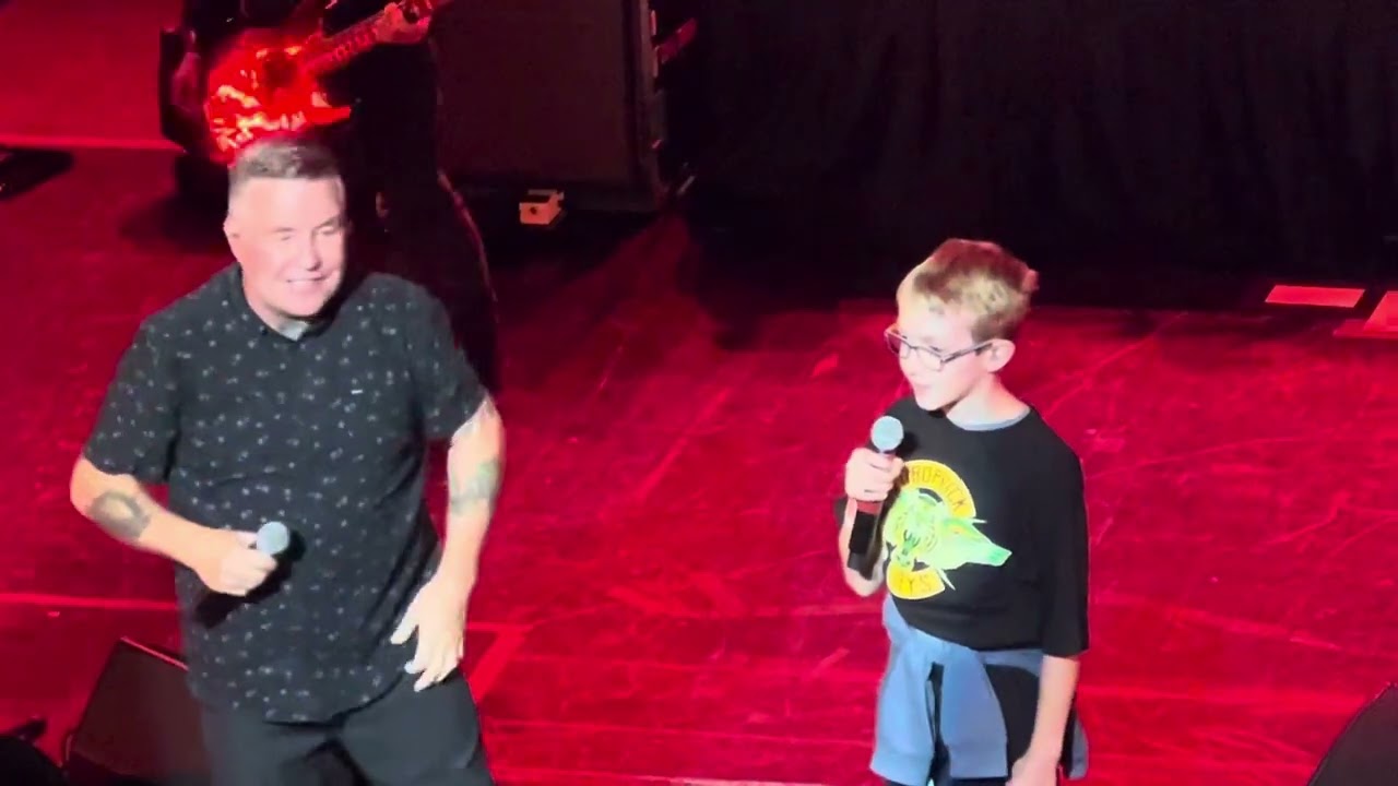Dropkick Murphy’s bring up a young fan to sing “Rose Tattoo” with them.