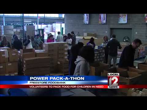 Freestore Foodbank volunteers pack food to feed children
