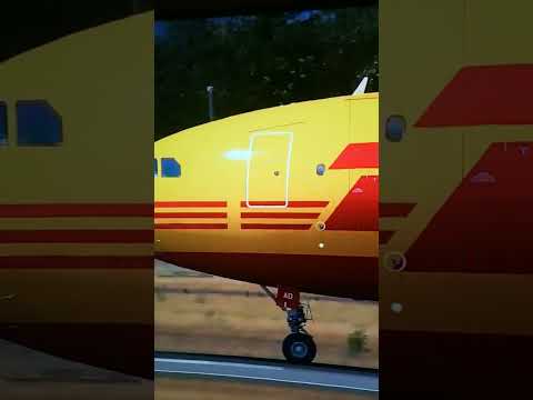DHL AIRLINES IS LANDING AT THE FRANKFURT AIRPORT IN GERMANY.