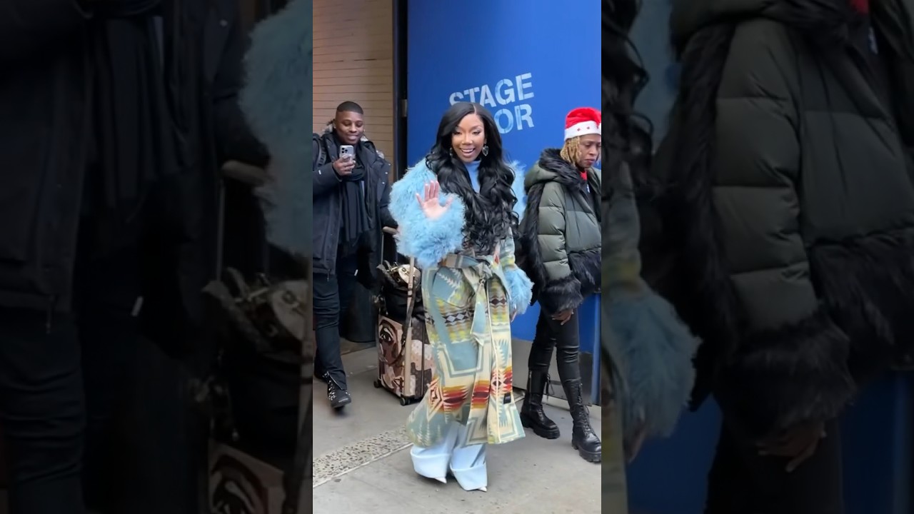 Brandy greets photogs in a colorful patterned coat in NYC! #brandy