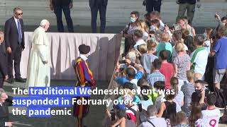 Pope Francis wears a face mask for the first time in public