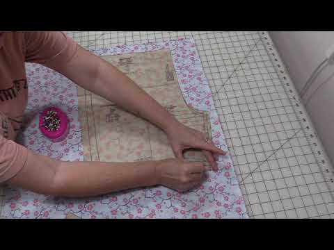 Cutting Out sewing pattern on fabric