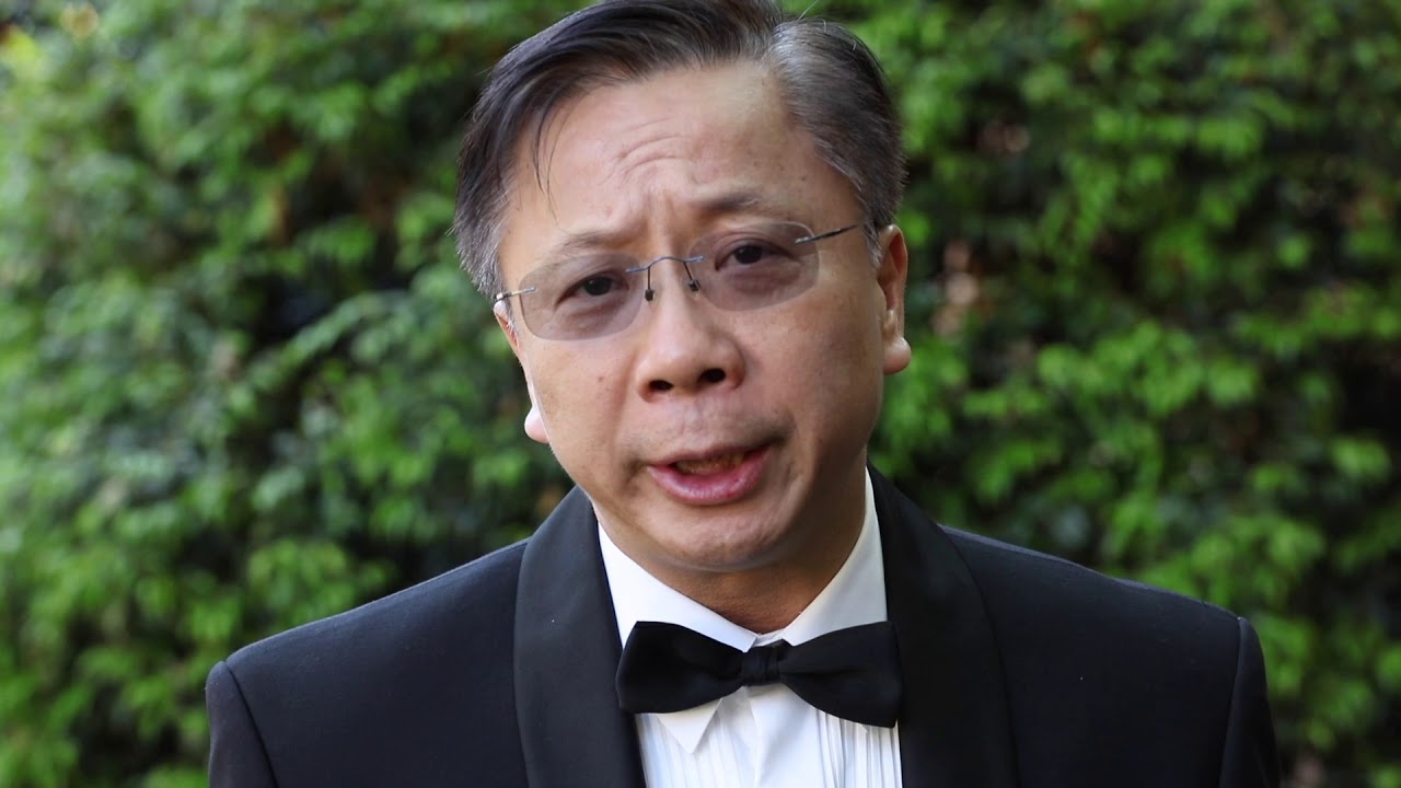 Professor Aibing Yu stands for his research team.