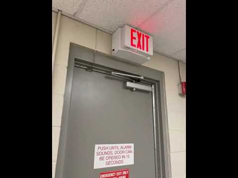 Exit sign & door closer & emergency exit door & Firelite BG 12 pull station & spectralert advance