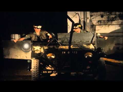 18th Military Police brigade signs in Saigon in M 151 armored jeep. HD Stock Footage