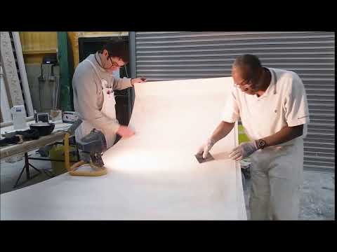 Polishing ceiling panel for Credit Suisse Auditorium