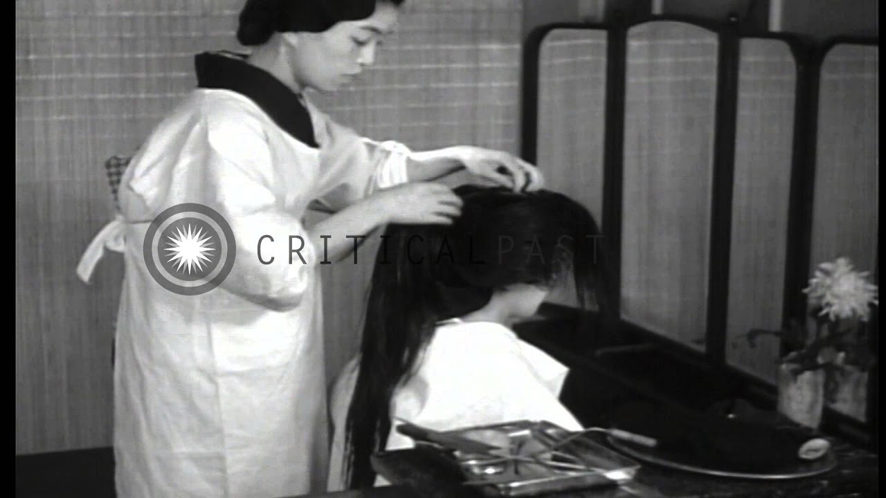 Japanese women get their hair styled in a Japanese beauty salon. HD Stock Footage