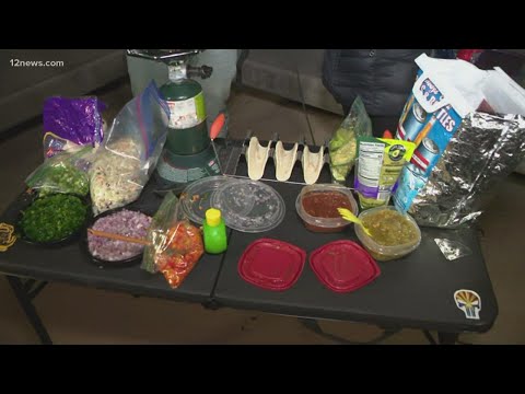Man cooks tacos on top of Valley mountains for hikers