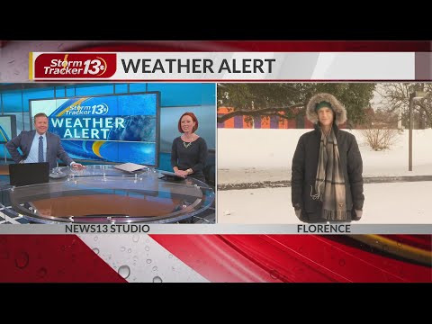 News13's Matt Fortin makes a snow angel in Florence