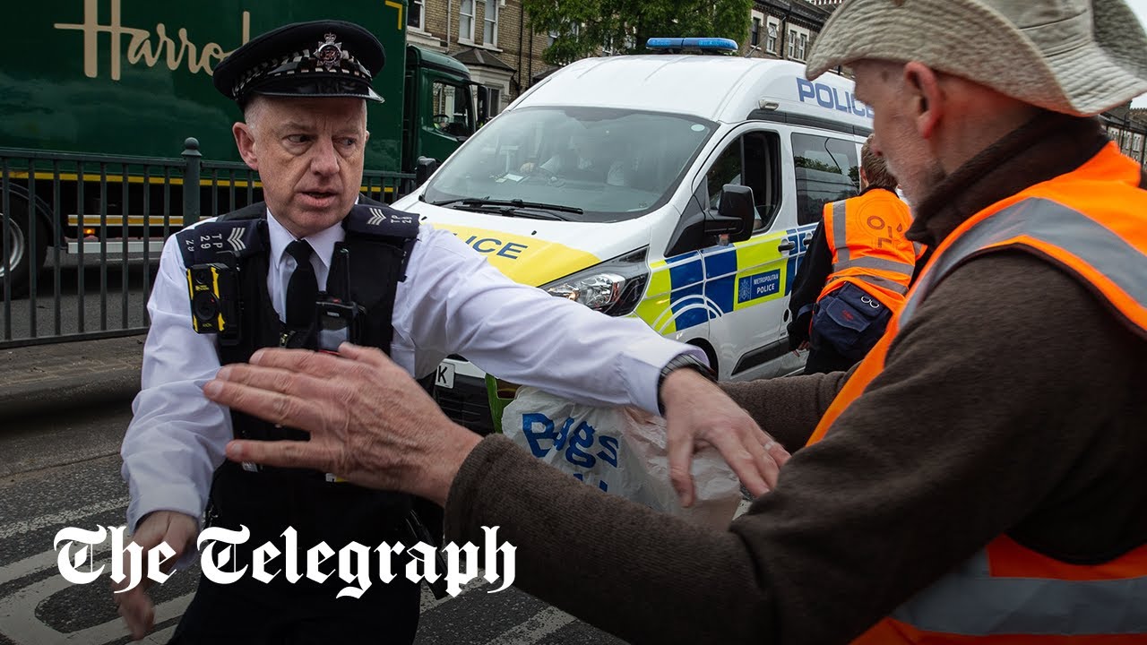 Watch: Police drag Just Stop Oil activists along road as officers ...