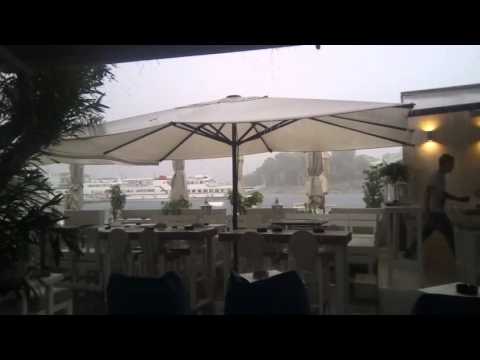 Heavy rain in Skiathos harbour bar