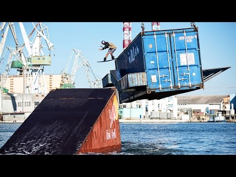 Watch A Wakeboarder Towed By A Crane Grind On Shipping Containers