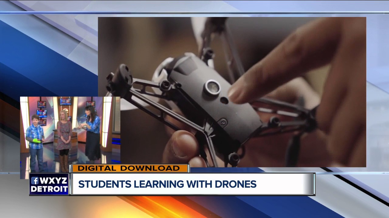 Students learning to code with drones
