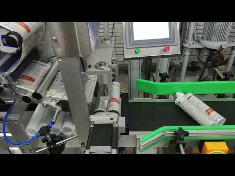 Fully automatic labeling machine for dual tube cartridge