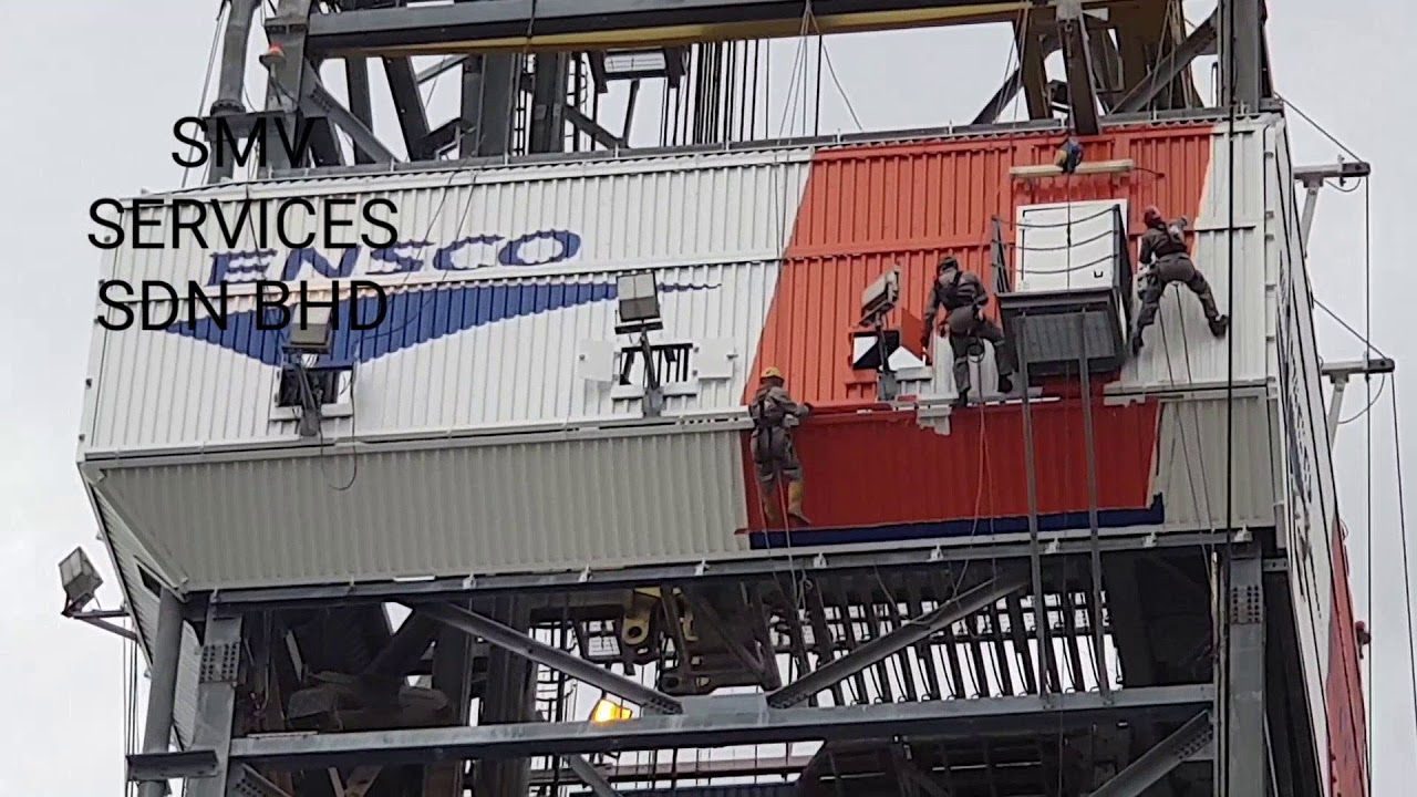 Derrick windwall logo making with rope access