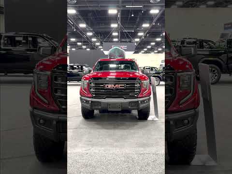 Volcanic Red 2024 GMC Sierra 1500 AT4X AEV at the Calgary Auto Show - Strathmore Motor Products