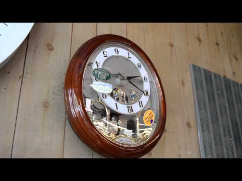 Rhythm Musical Wall Clock With Moving Dial, Pendulum And Swarovski 4MJ854WD06