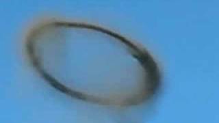 Mystery as floating black ring soars across clouds but is it a UFO ...