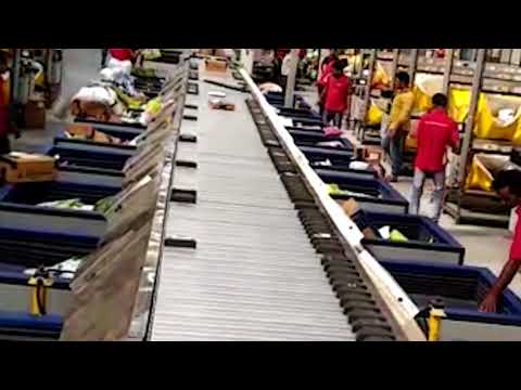 Warehouse Sorting Systems - Tilt Tray Sorter (Loop) - Falcon Autotech ...