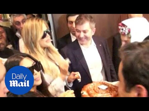 Kim and Khloe greeted by fans as they land in Armenia - Daily Mail