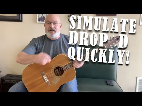 How to Simulate Drop D Quickly Using A Capo! It's still E. Basically "tuning" the other strings up.