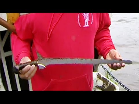 Coracleman nets 18th Century sword in River Towy