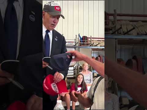 Joe Biden swaps hats with Trump supporter