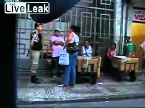 Brazilian police beats histerical woman