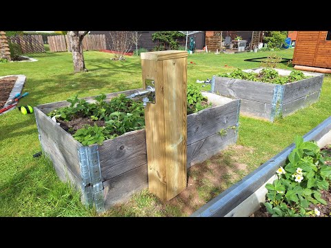 Vattenkran i trädgård, med PEM-slang och gardenaslang