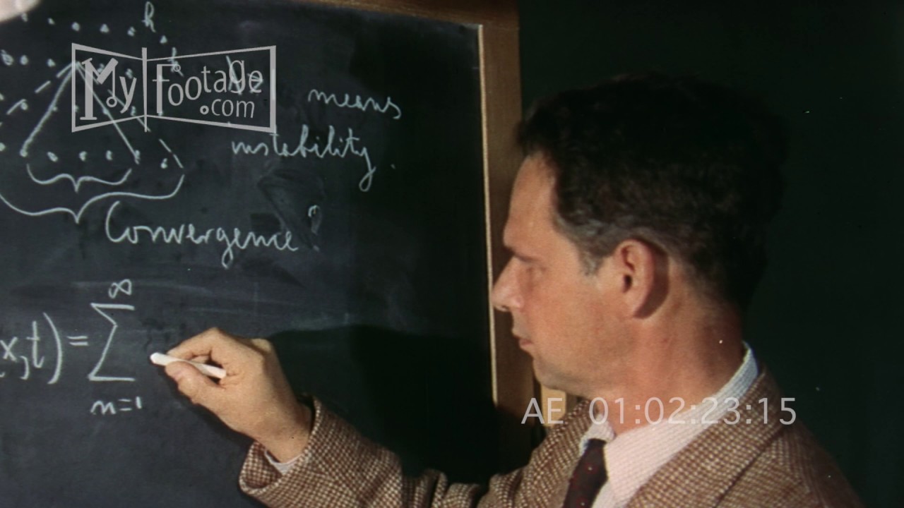 1950s Engineer Writes Scientific Equations on Blackboard