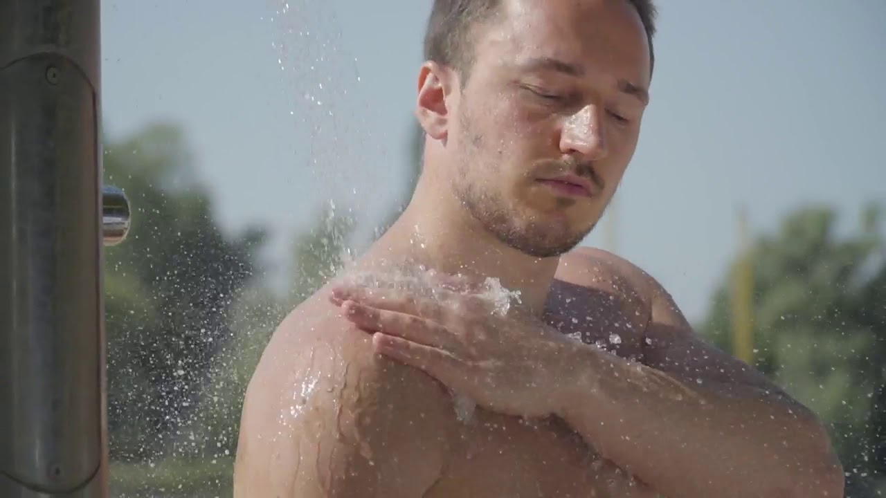 7 1 Beach mixkit muscular man in outdoor beach shower 12956 medium