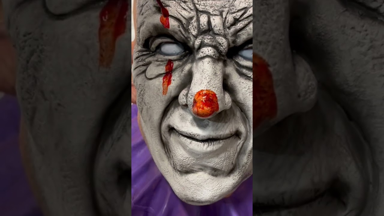 Painting an evil clown mask.