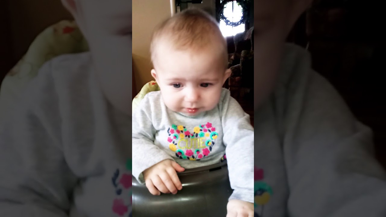 Funny baby tries a popsicle for the first time